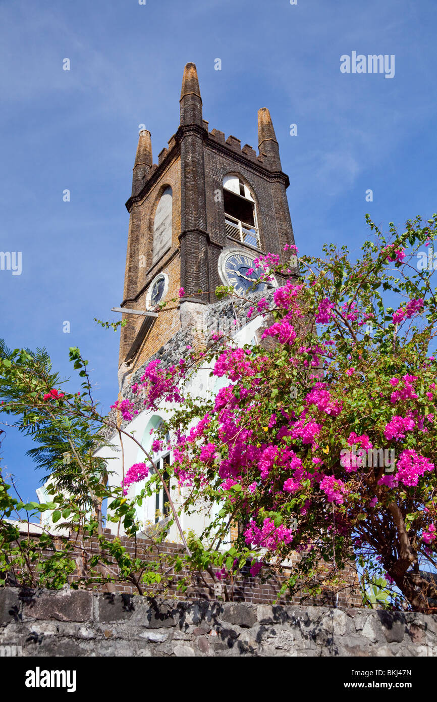 An old church steeple with bougainvillea flowers in St. George's ...