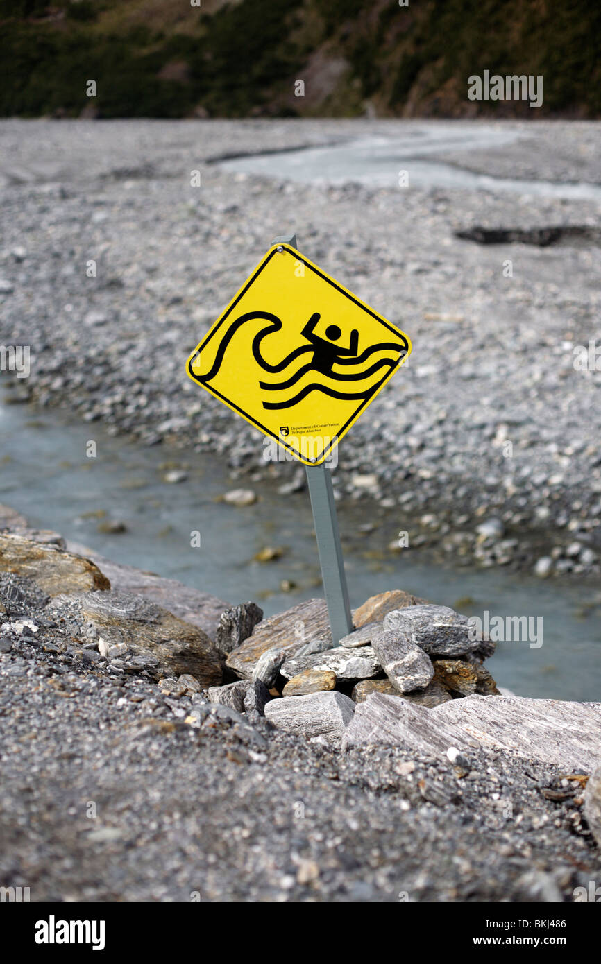 Warning signs near the terminal face of the Fox Glacier in Westland Tai ...