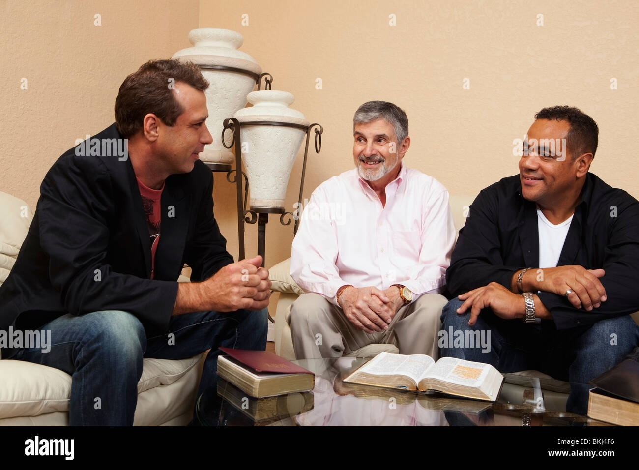 Men In A Home Bible Study Stock Photo - Alamy