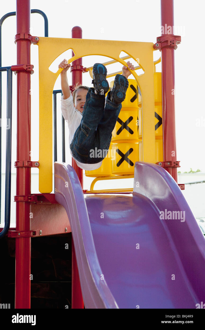 Young Boy Playing At The Playground Stock Photo - Alamy