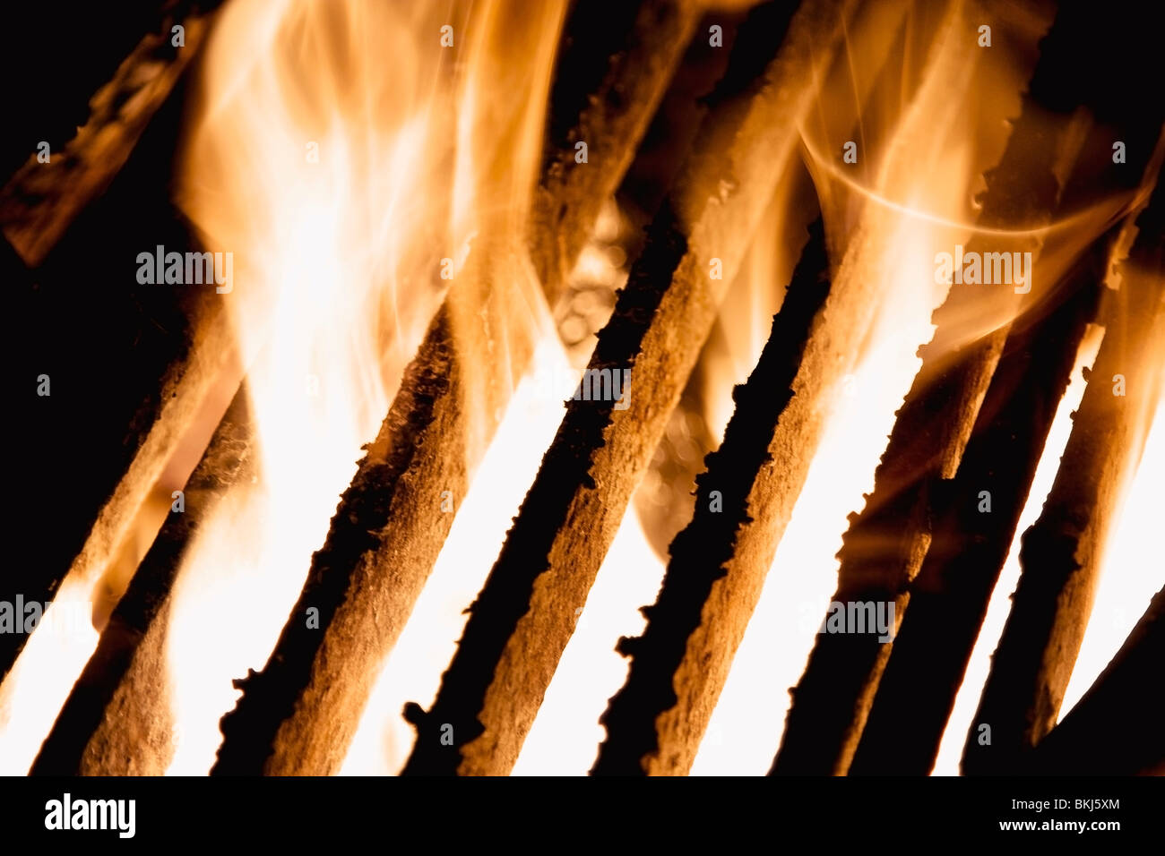 Flames Coming Up Between The Grill Stock Photo - Alamy