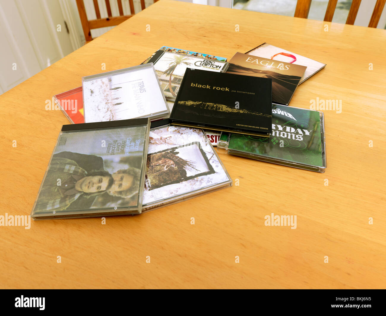 Pile Of Compact Discs Spread Out On Table Stock Photo - Alamy