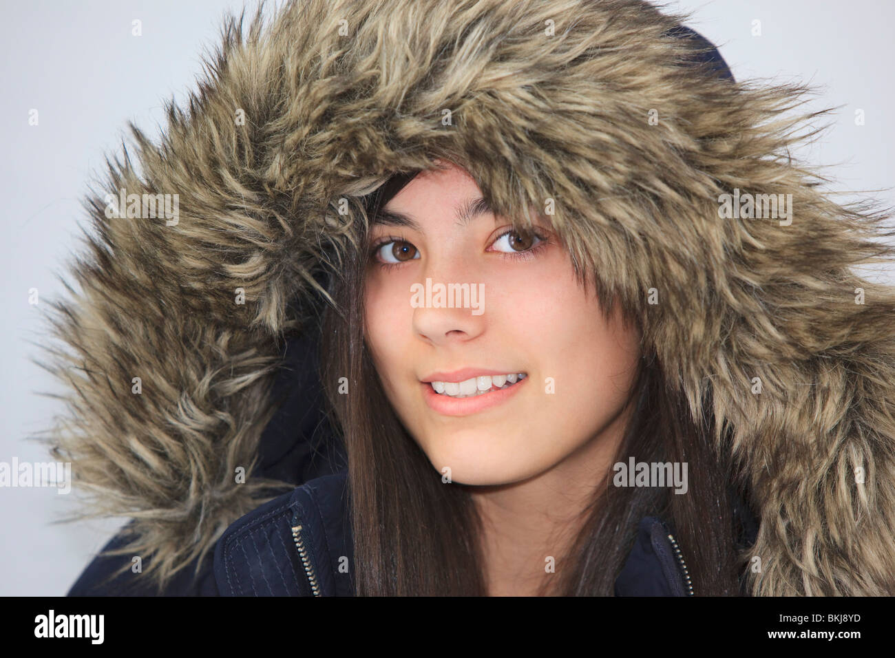 A Teenage Girl Wearing A Fur Trimmed Hood Stock Photo - Alamy