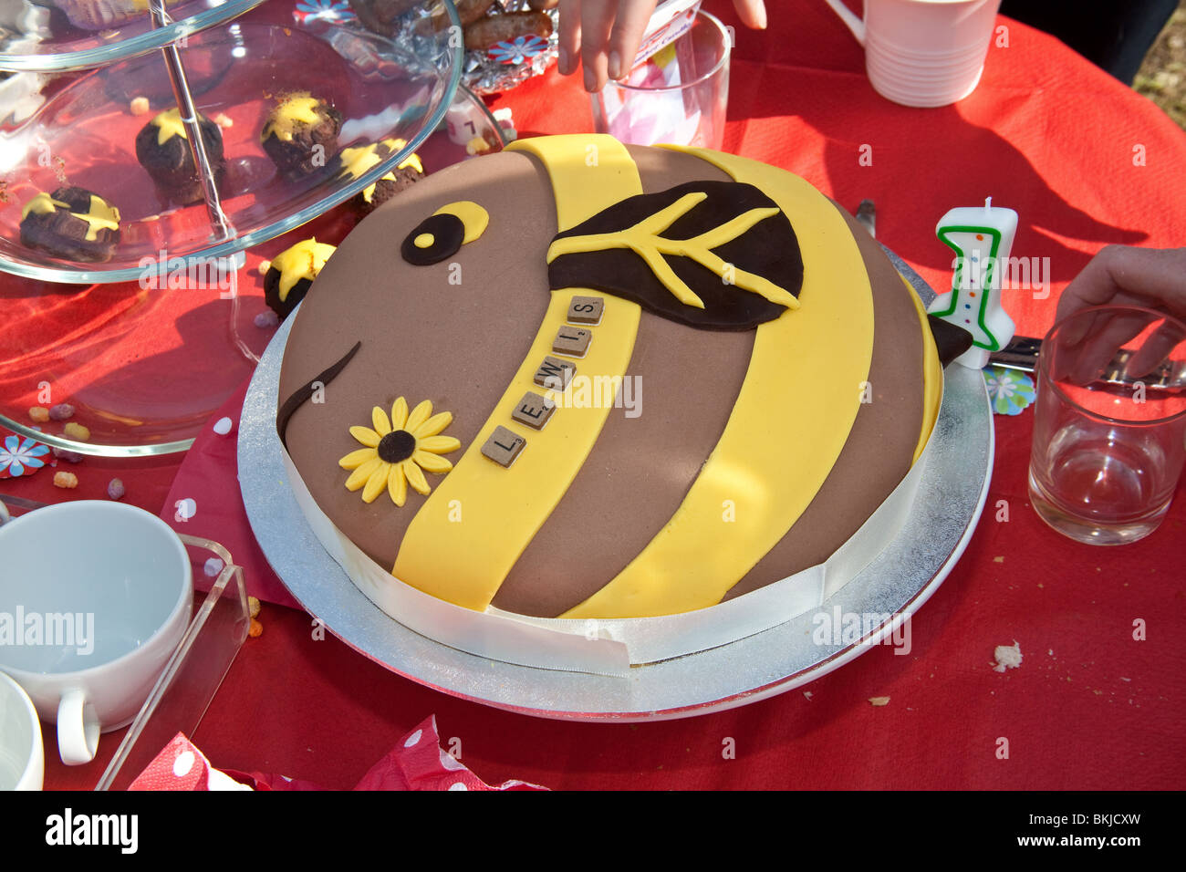 A birthday cake in the shape of a bee Stock Photo - Alamy
