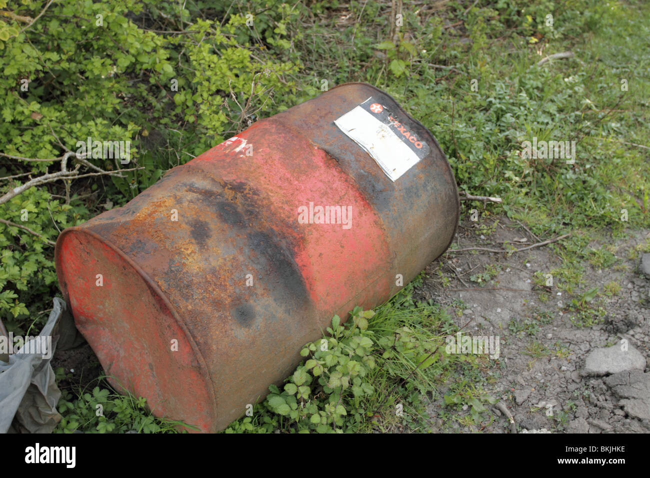 Old dumped oil drums Stock Photo - Alamy