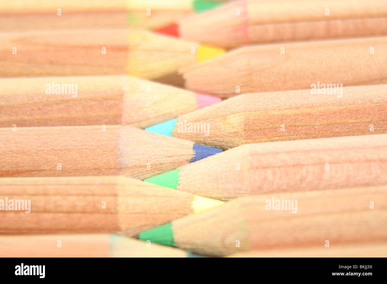Colourful pencil crayons photographed laid out creating a pleasant zig ...