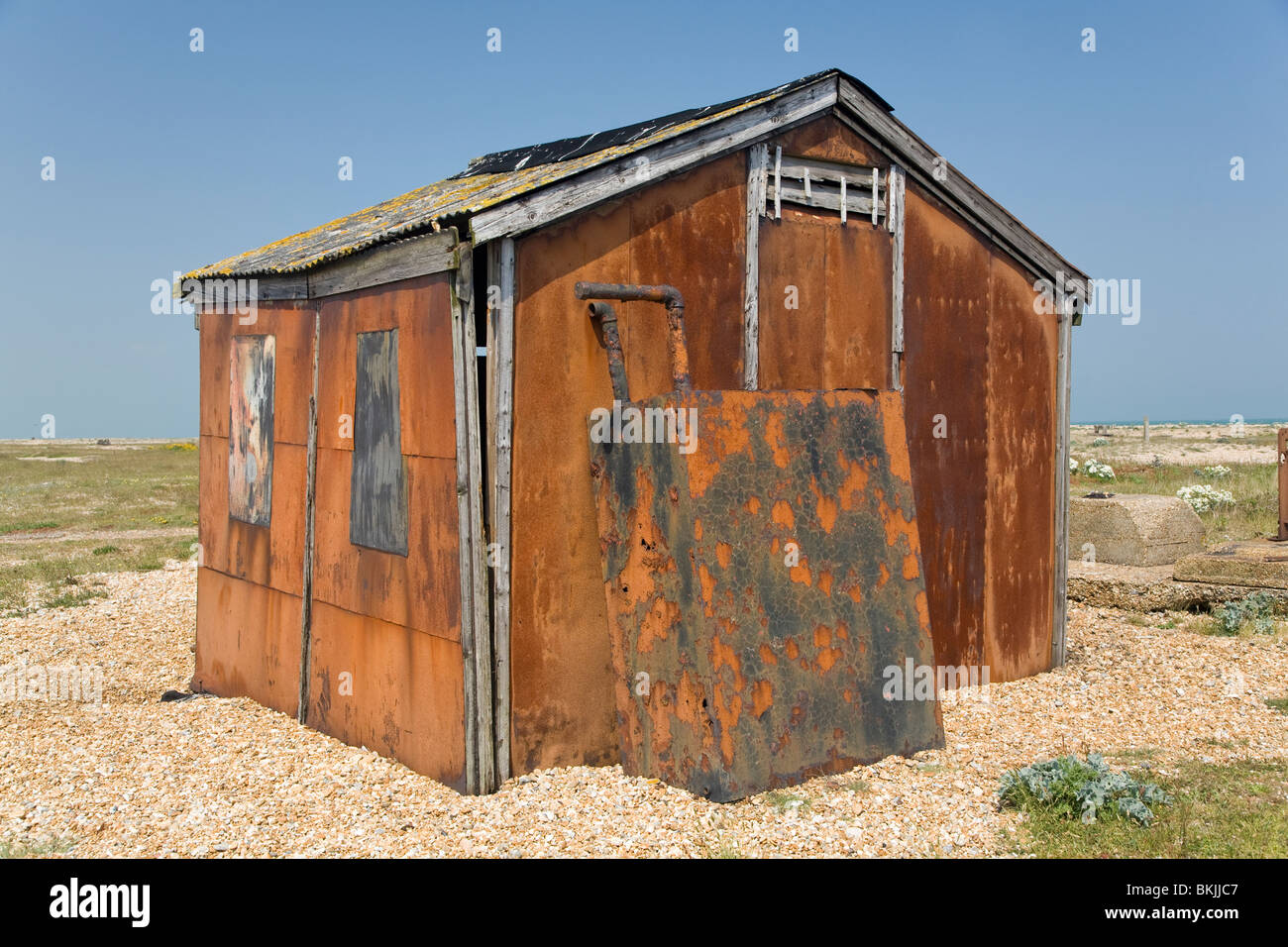 Rusty fisherman's shed on Dungeness shingle beach, Kent England UK ...