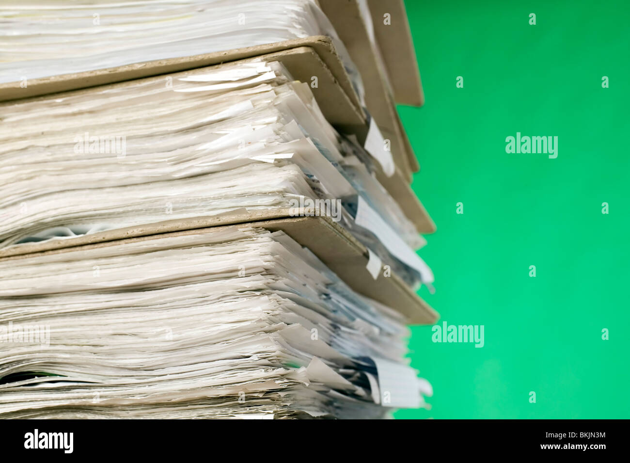 There are documents and papers on green background Stock Photo - Alamy