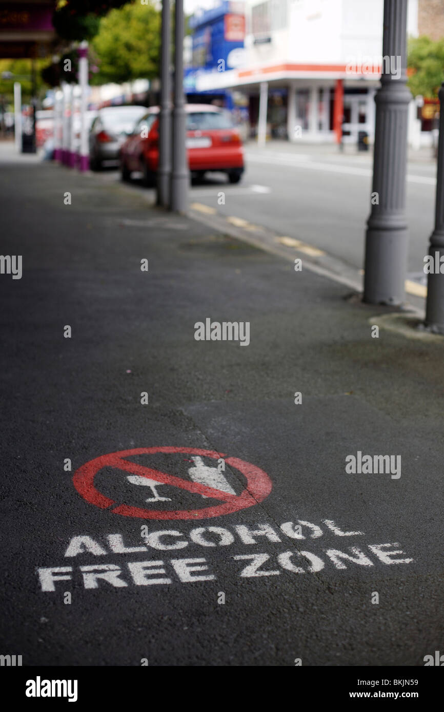 A pavement sign indicating a no alcohol zone in Nelson in New Zealand ...