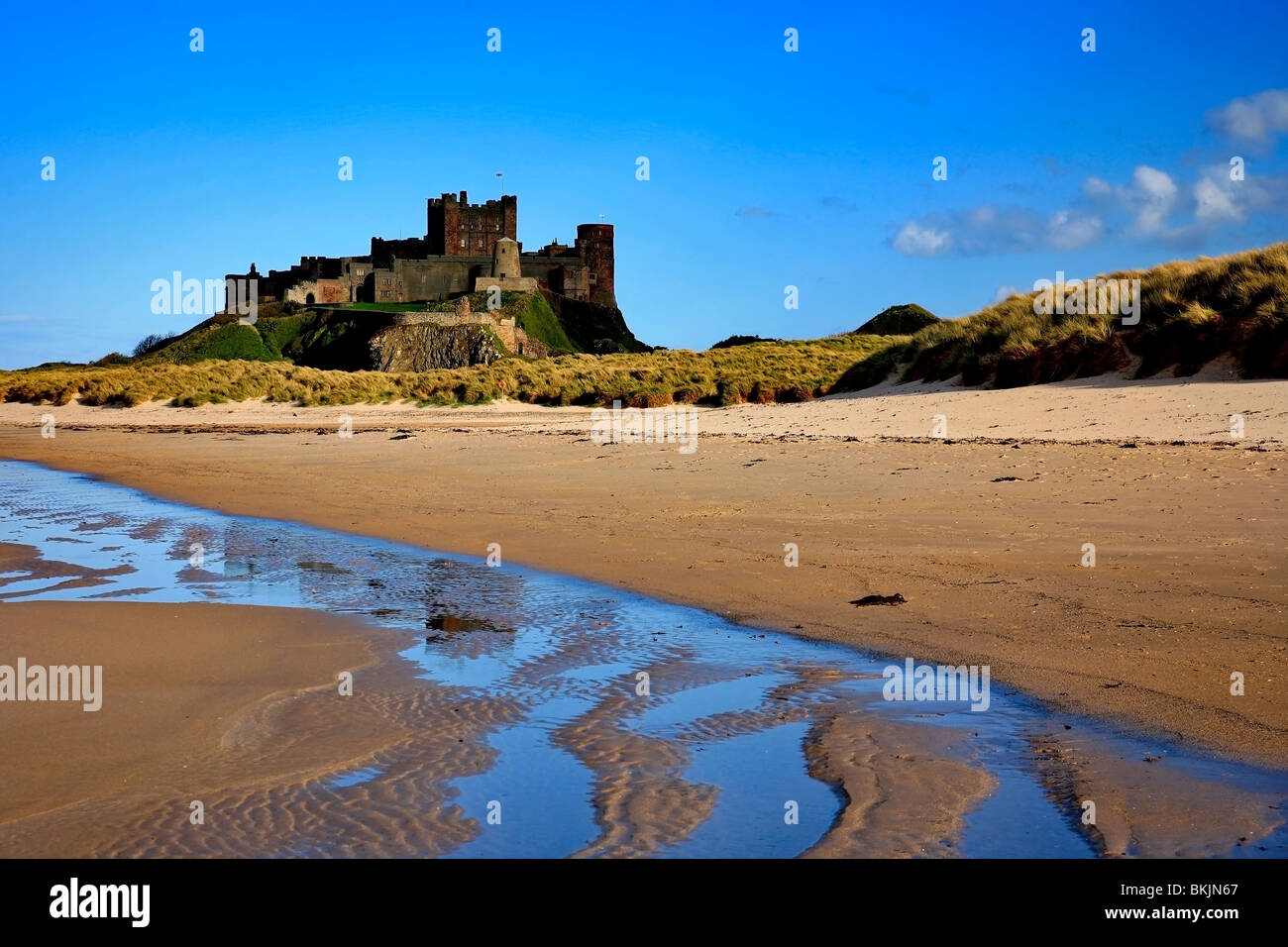 Bamburgh Castle view from beach Bamburgh village North Northumbrian ...