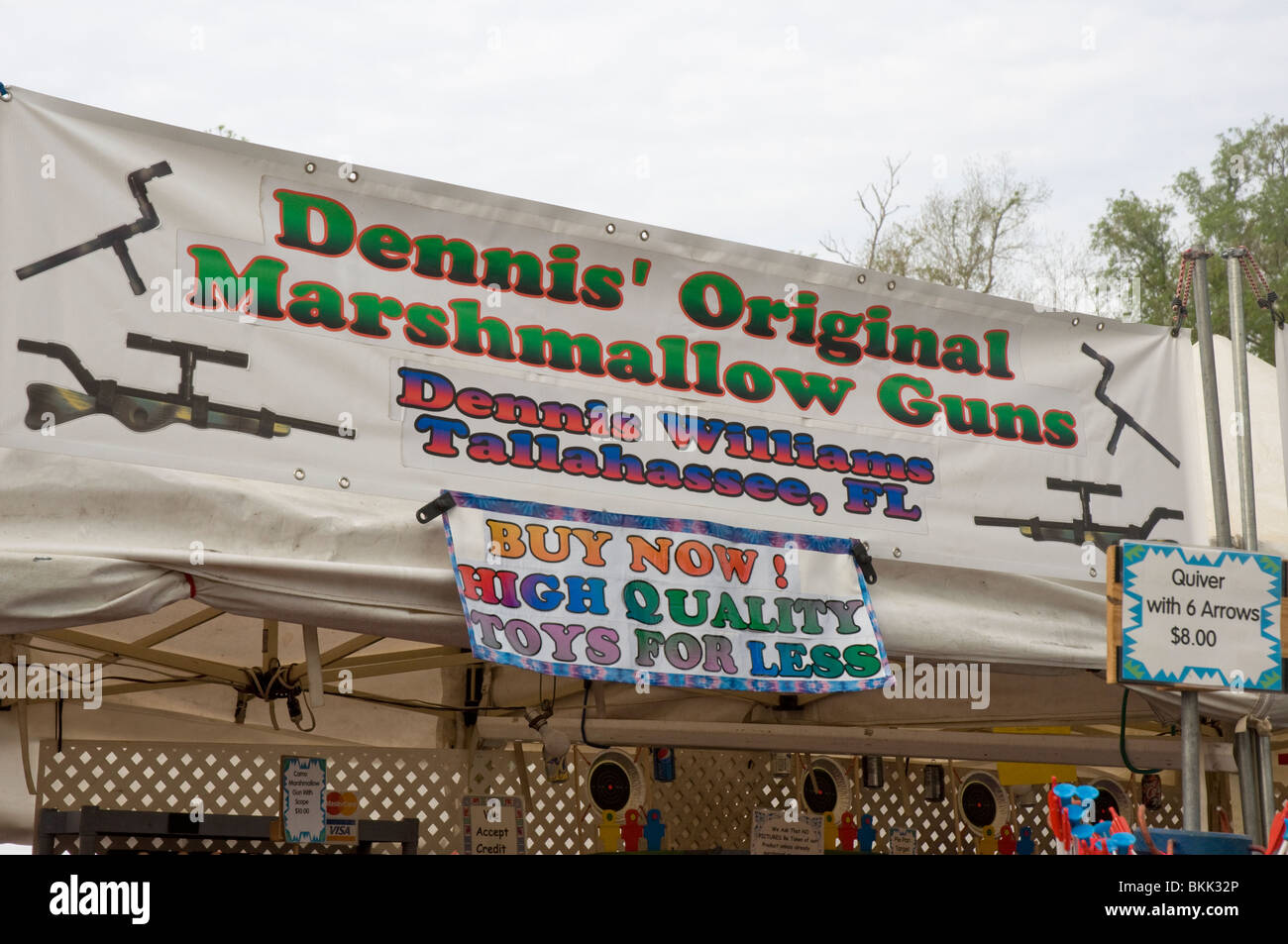 festival booth selling novelty toy marshmallow guns Stock Photo - Alamy