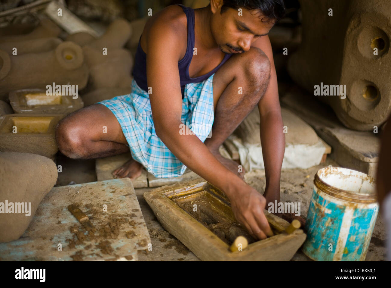 Craftsmen at the workshop of S.Stapathy and Sons, mould local clay ...