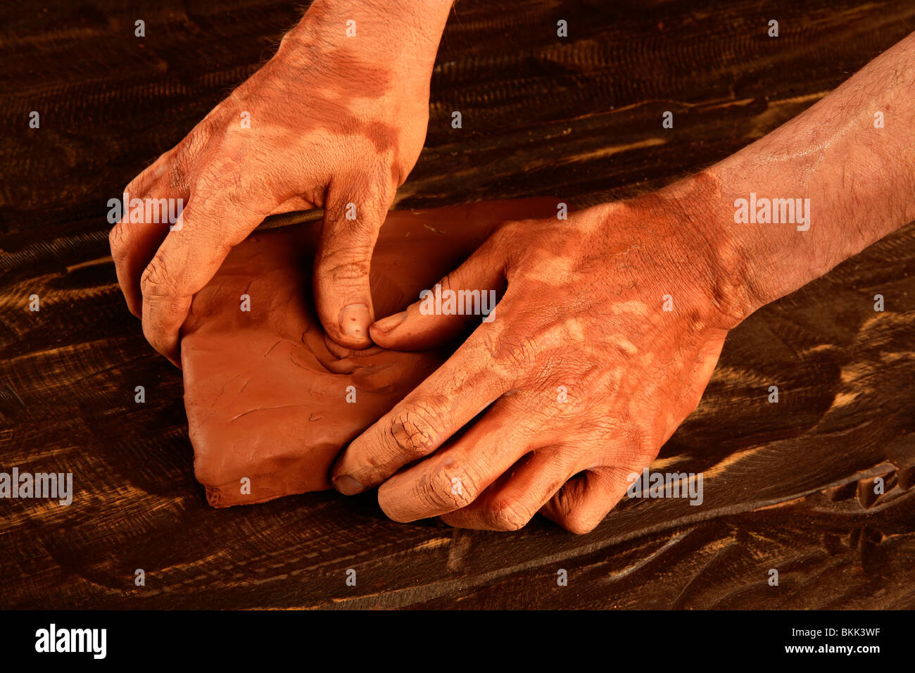 artist man hands working red clay to create handcraft art Stock Photo ...