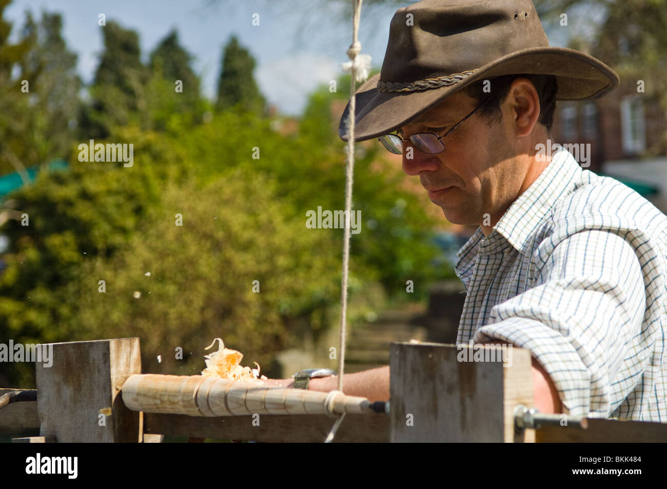 Male green wood worker using traditional wooden lath Stock Photo - Alamy