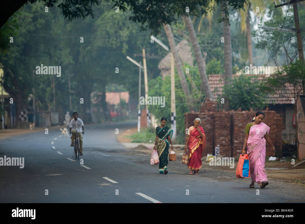 Just after dawn, people cycle and walk through the sleepy temple town ...