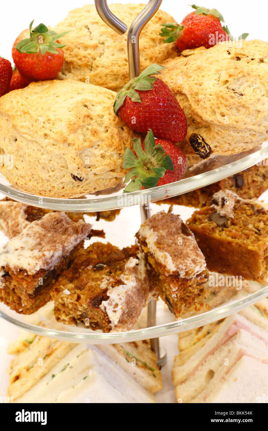 cake stand with Strawberries and scones, Walnut cake sponge, ham and ...