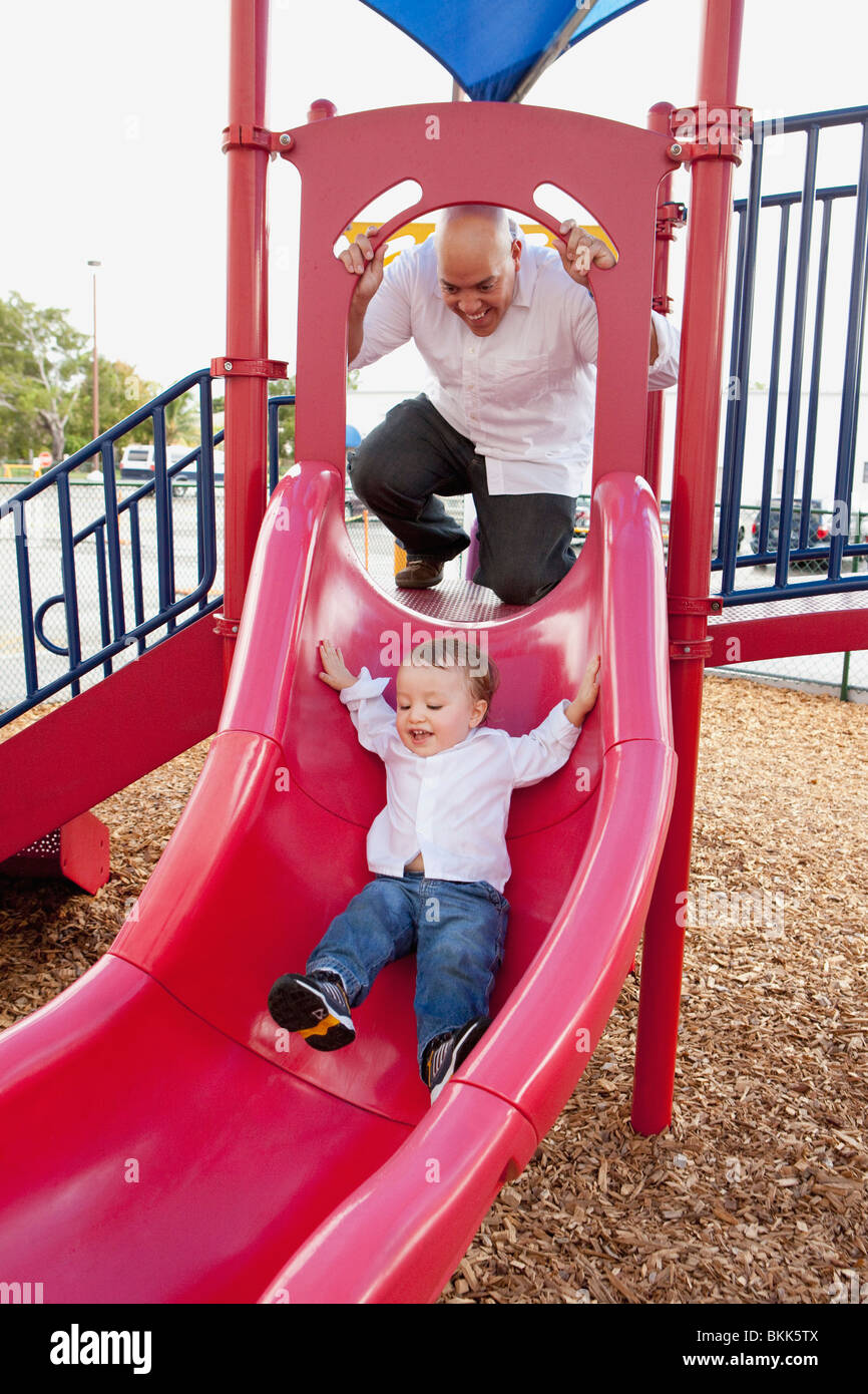 A Father And Son Playing At The Playground Stock Photo - Alamy