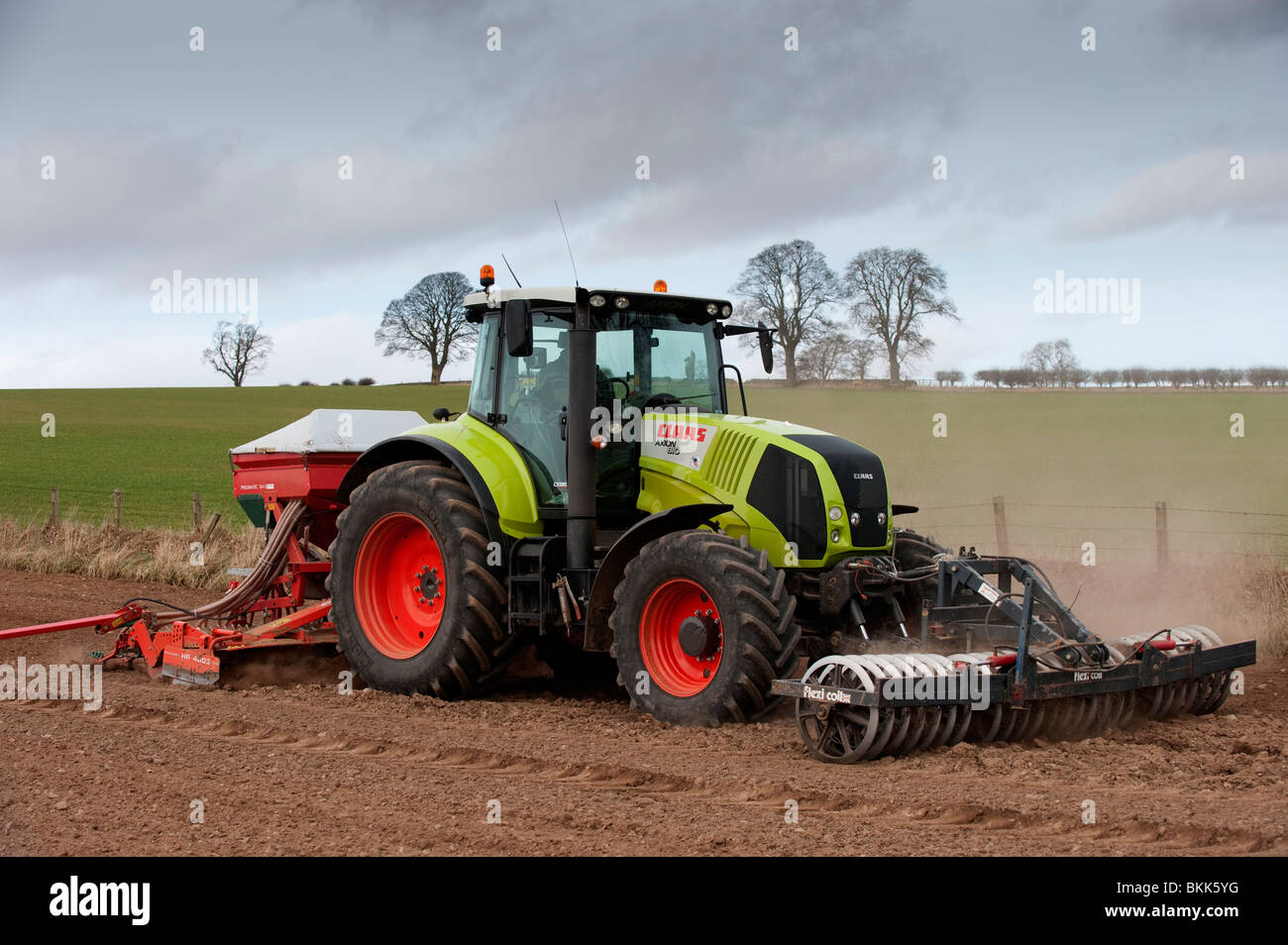 Claas Axion 810 tractor with seed drill and press on and top soil ...