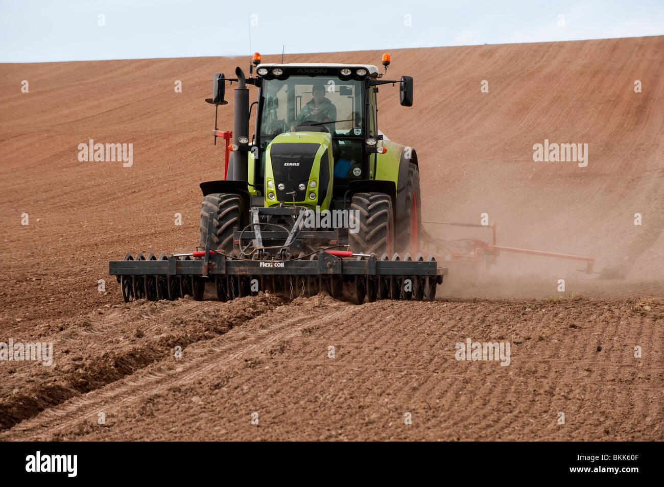 Claas Axion 810 tractor with seed drill and press on and top soil ...