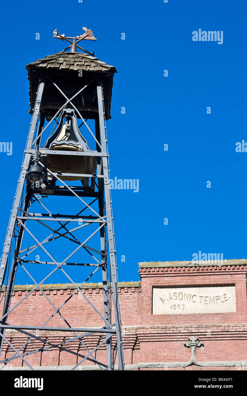 Historic old bell tower stands in front of Masonic Temple lodge along ...