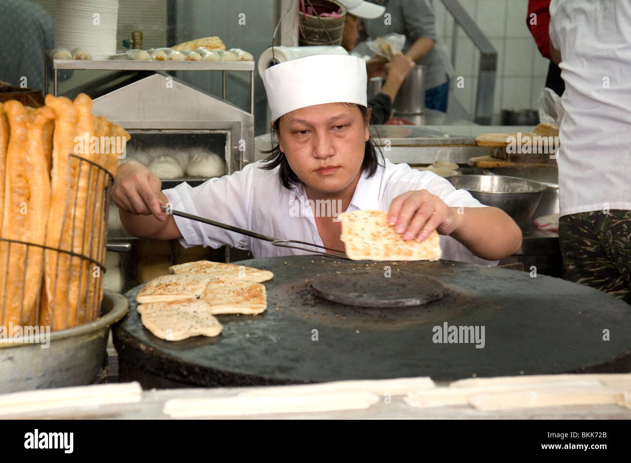 Cafeteria cook serving up savoury pancakes, Taipei, Taiwan Stock Photo ...