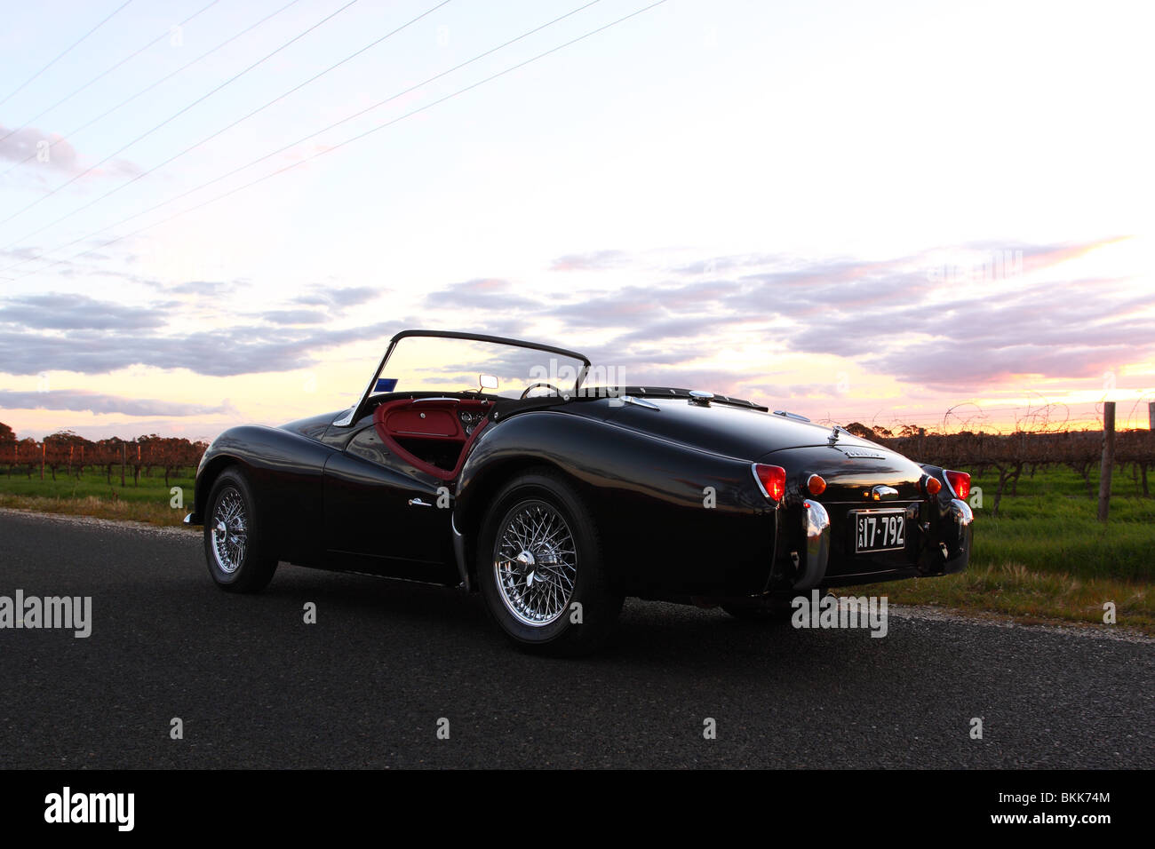 1958 Triumph TR3a classic sportscar's rear end at sundown in McLaren ...