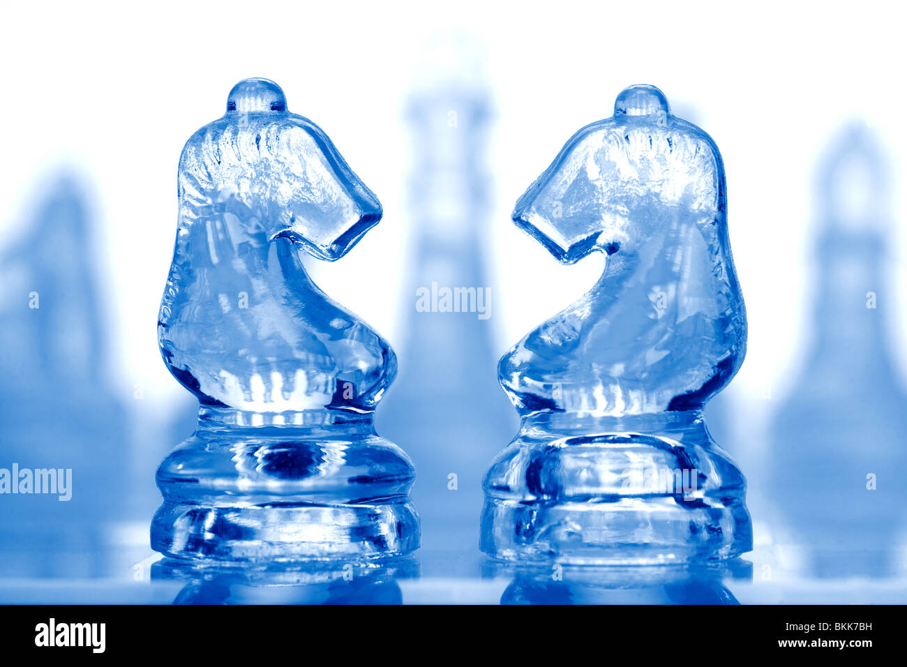 glass chess pieces with blue light Stock Photo - Alamy
