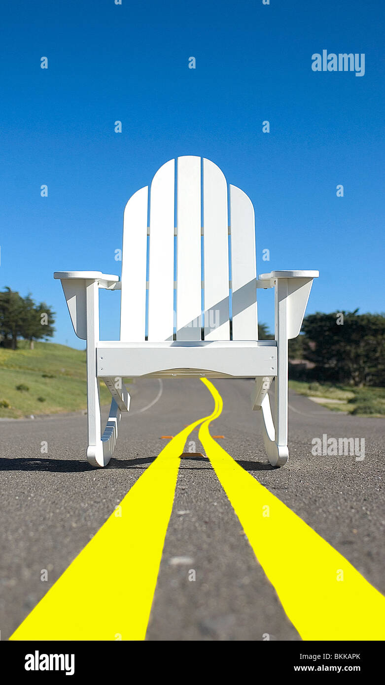 Adirondack chair in middle of road Stock Photo - Alamy