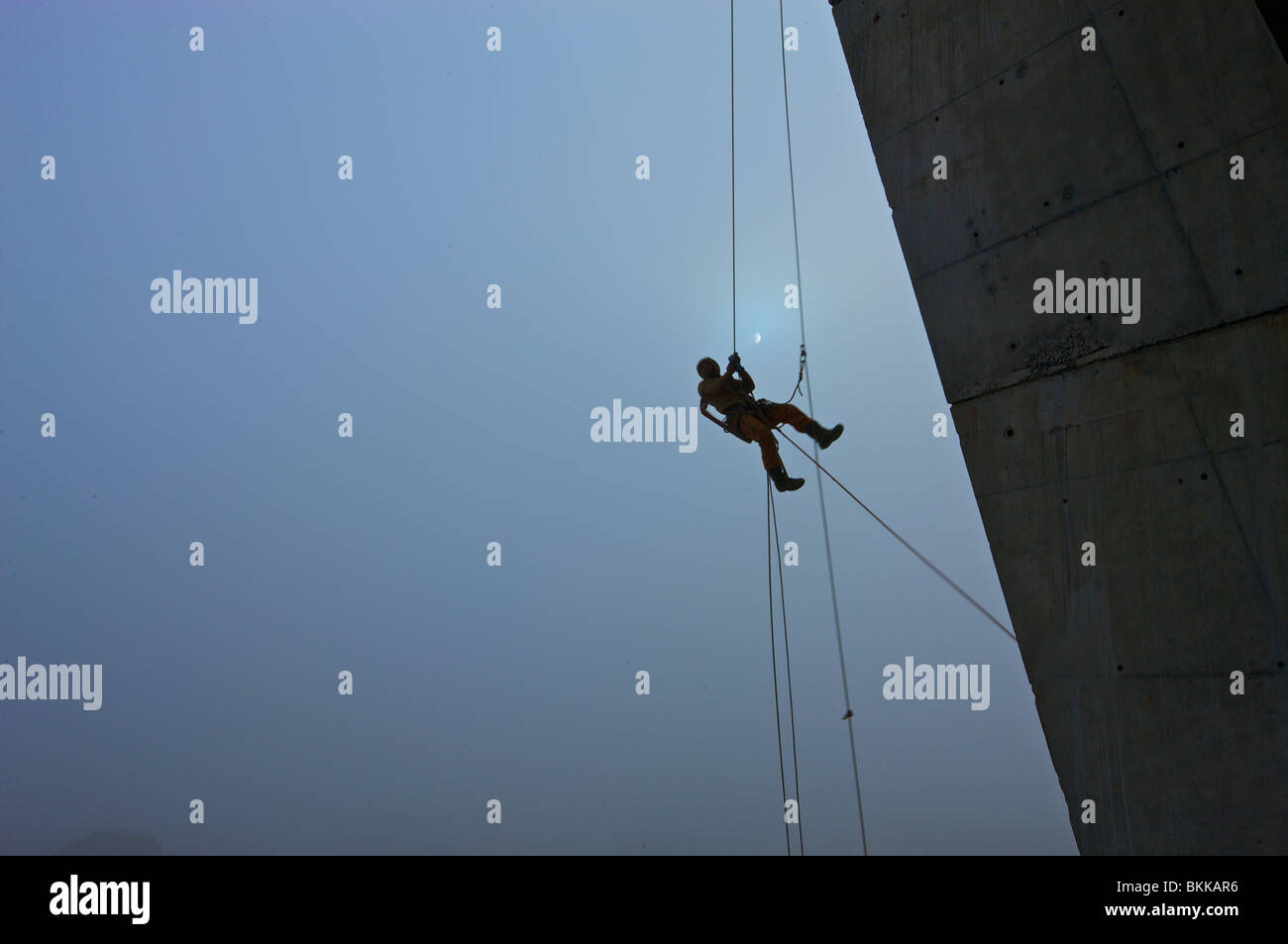 A construction worker abseiling to the next level at the Cape Town ...