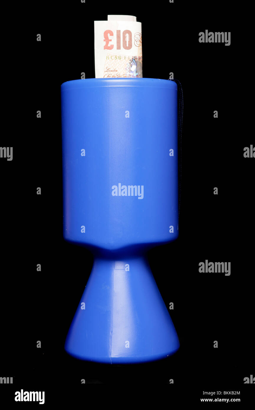 Charity collection tin with ten pounds Stock Photo - Alamy