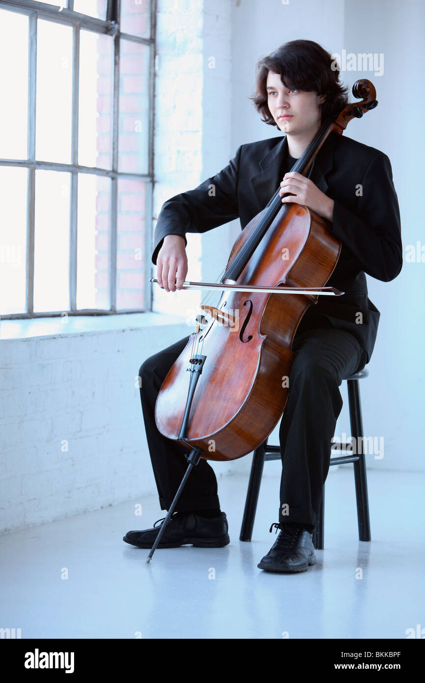 A Young Man Playing A Cello Stock Photo - Alamy