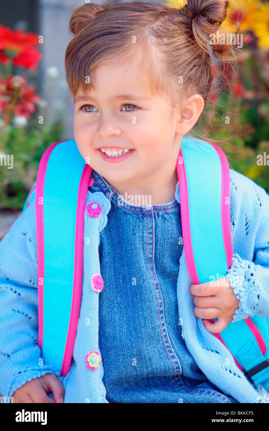 A Young Girl Wearing A Backpack Stock Photo - Alamy
