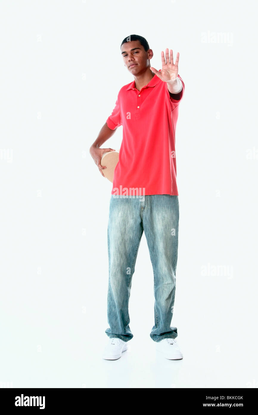 A Young Man Holding Out His Hand To Say Stop With A Heart Held Behind ...