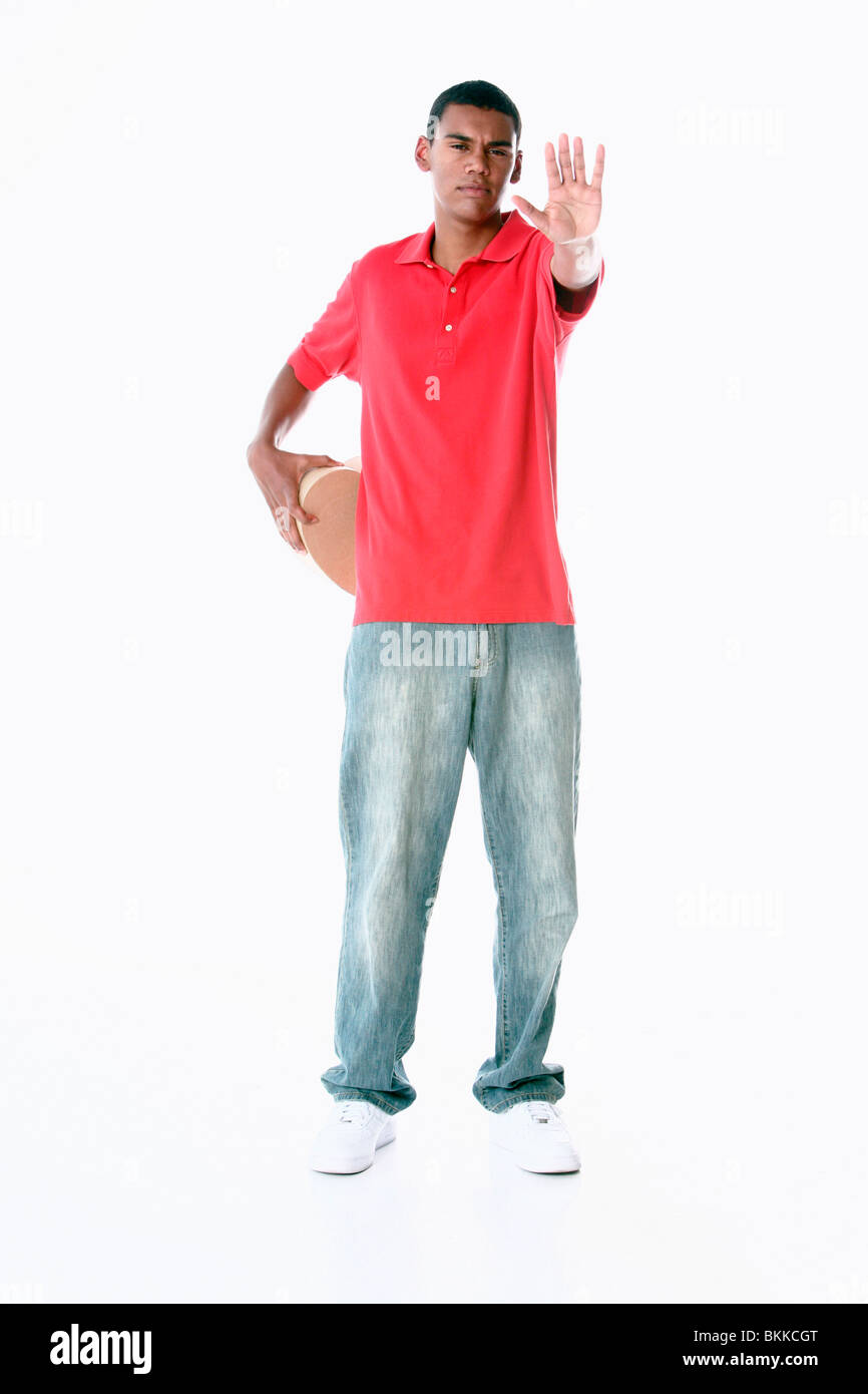 A Young Man Holding Out His Hand To Say Stop With A Heart Held Behind ...