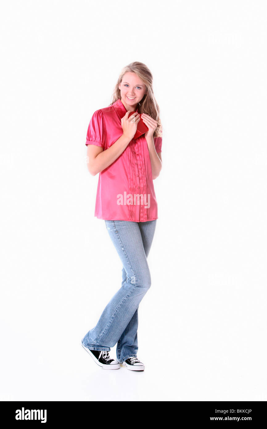 A Girl Holding A Heart To Her Chest Stock Photo - Alamy