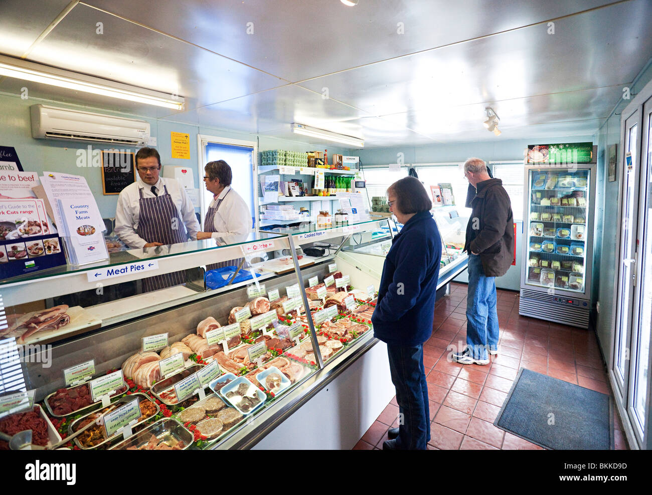meat display at a butchers shop Stock Photo - Alamy