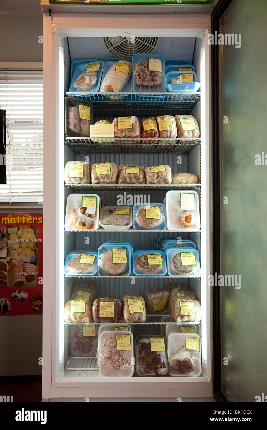 frozen meat display at a butchers shop Stock Photo - Alamy