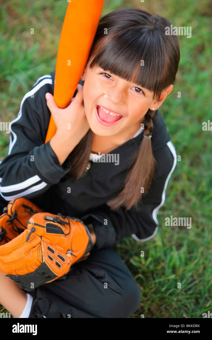 A Young Girl With A Baseball Bat And Glove Stock Photo - Alamy