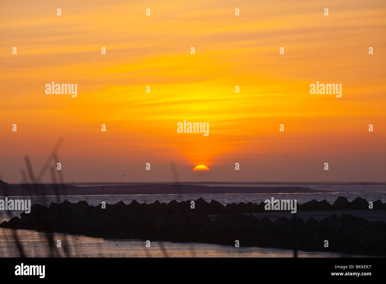 Orange volcanic dust sunset at Dutch coastal area Stock Photo - Alamy
