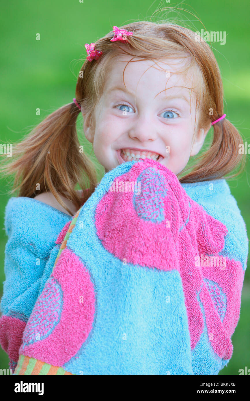 A Young Girl Wrapped In A Towel Stock Photo - Alamy
