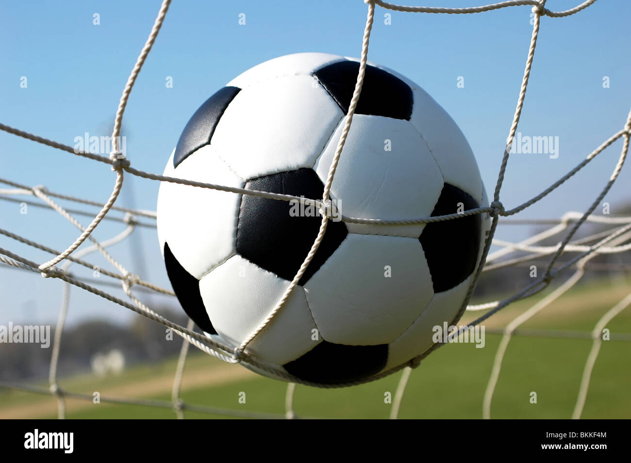 Soccer ball in net. Scoring goal Stock Photo - Alamy