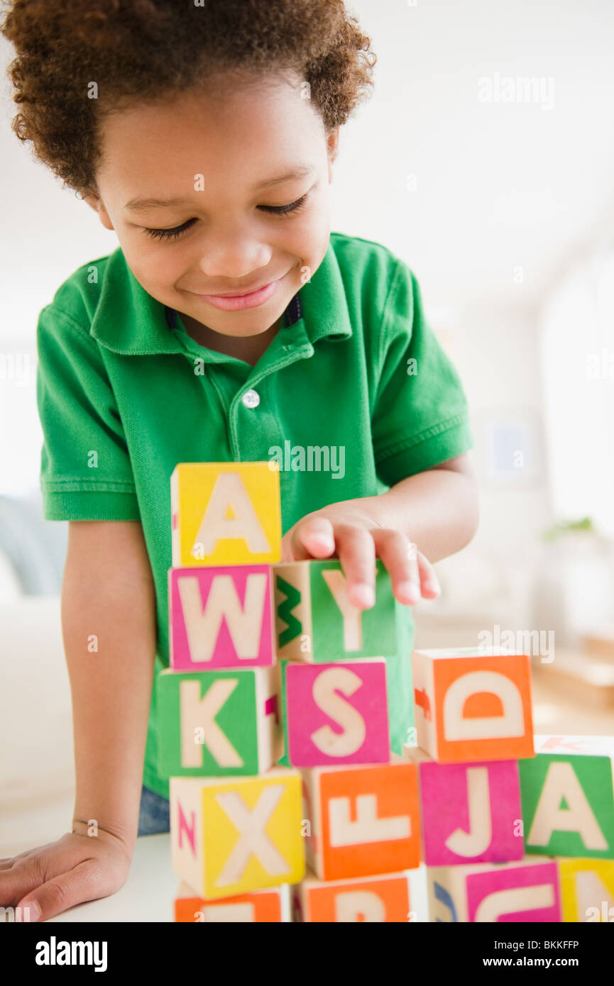 Black blocks boy hi-res stock photography and images - Alamy
