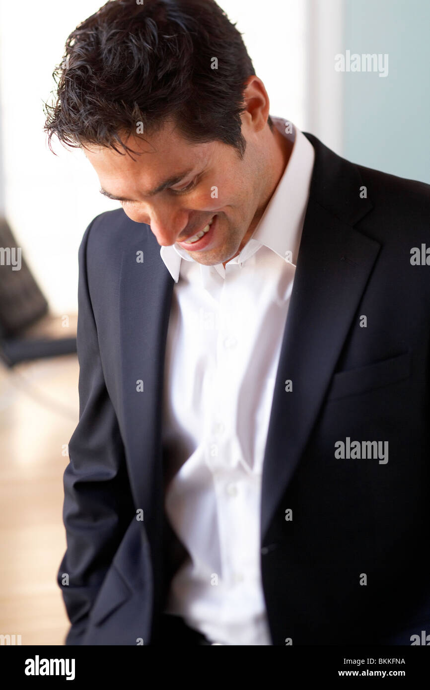 Man in suit smiling Stock Photo - Alamy