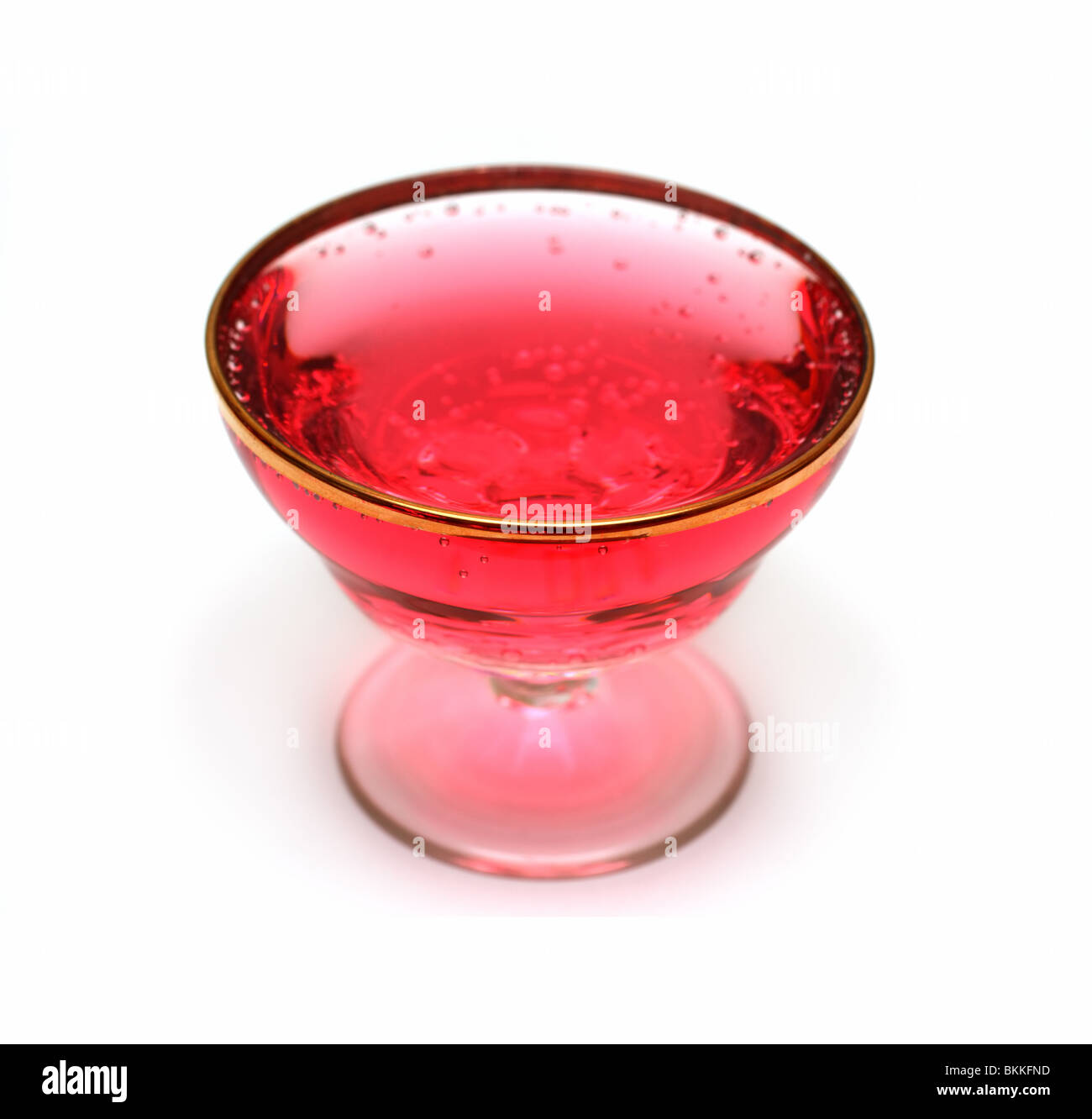 glass with red aerated water isolated on white Stock Photo - Alamy