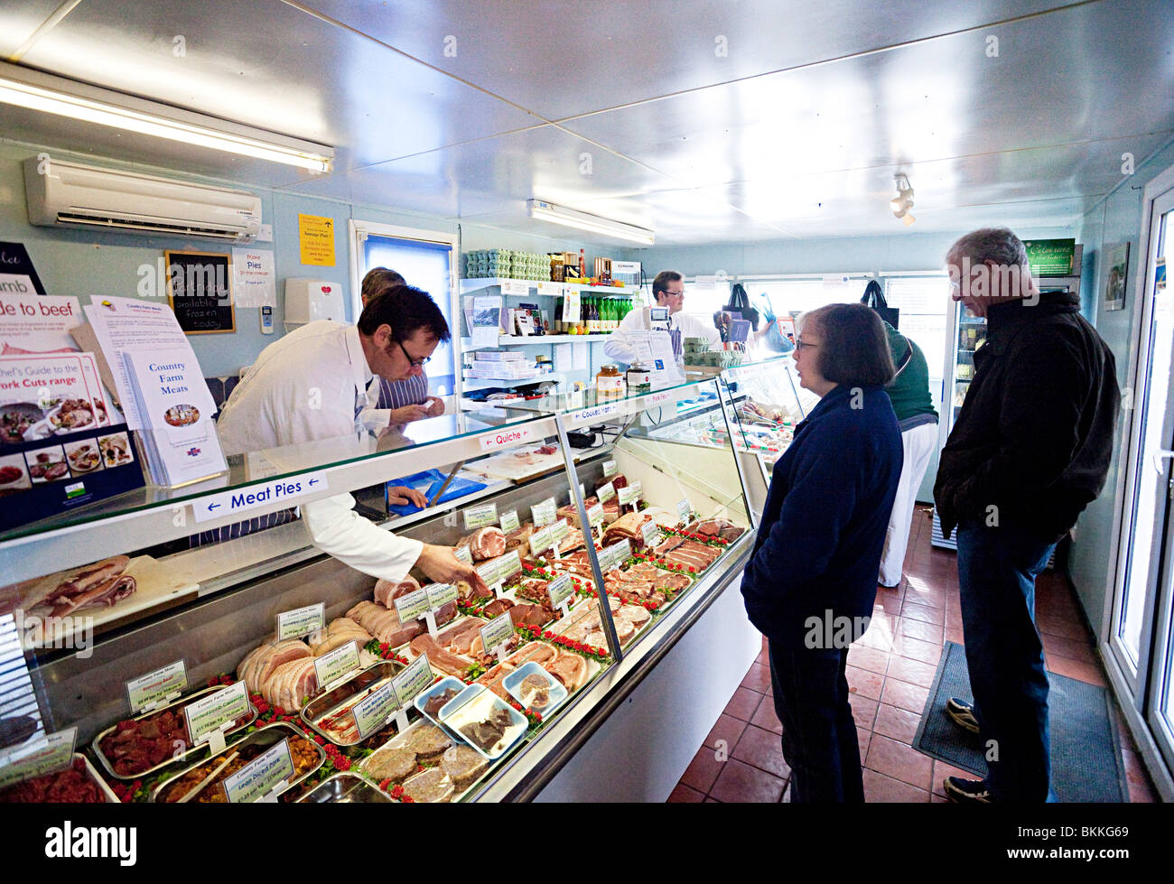 meat display at a butchers shop Stock Photo - Alamy