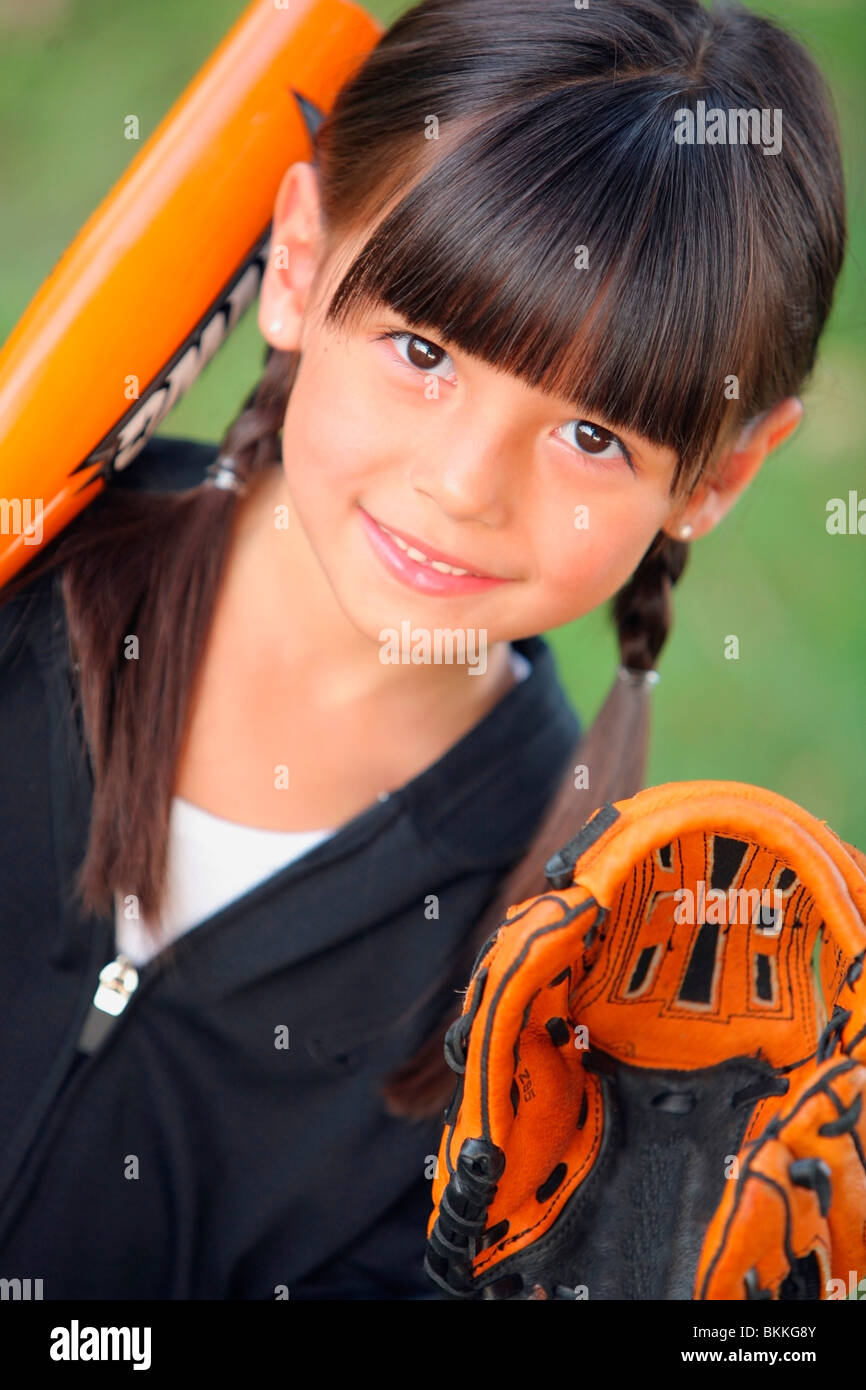 A Young Girl With A Baseball Bat And Glove Stock Photo - Alamy