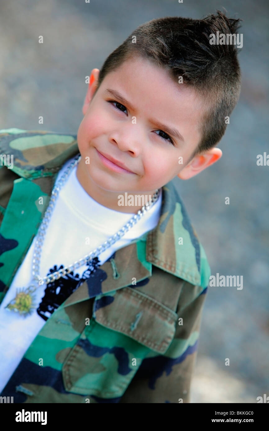 A Young Boy With A Mohawk And Wearing Camouflage Stock Photo - Alamy
