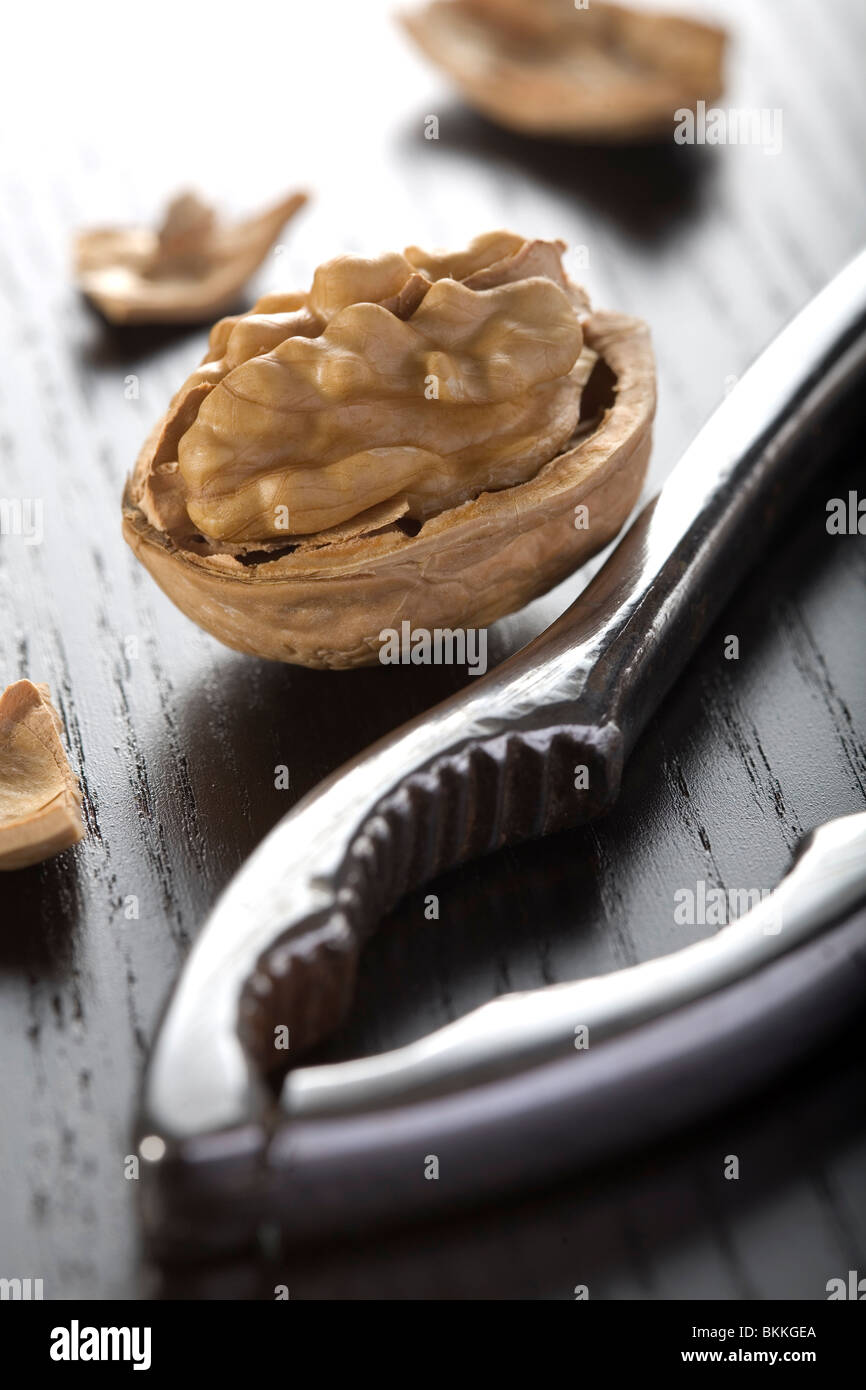 cracked open walnut and nutcracker Stock Photo - Alamy