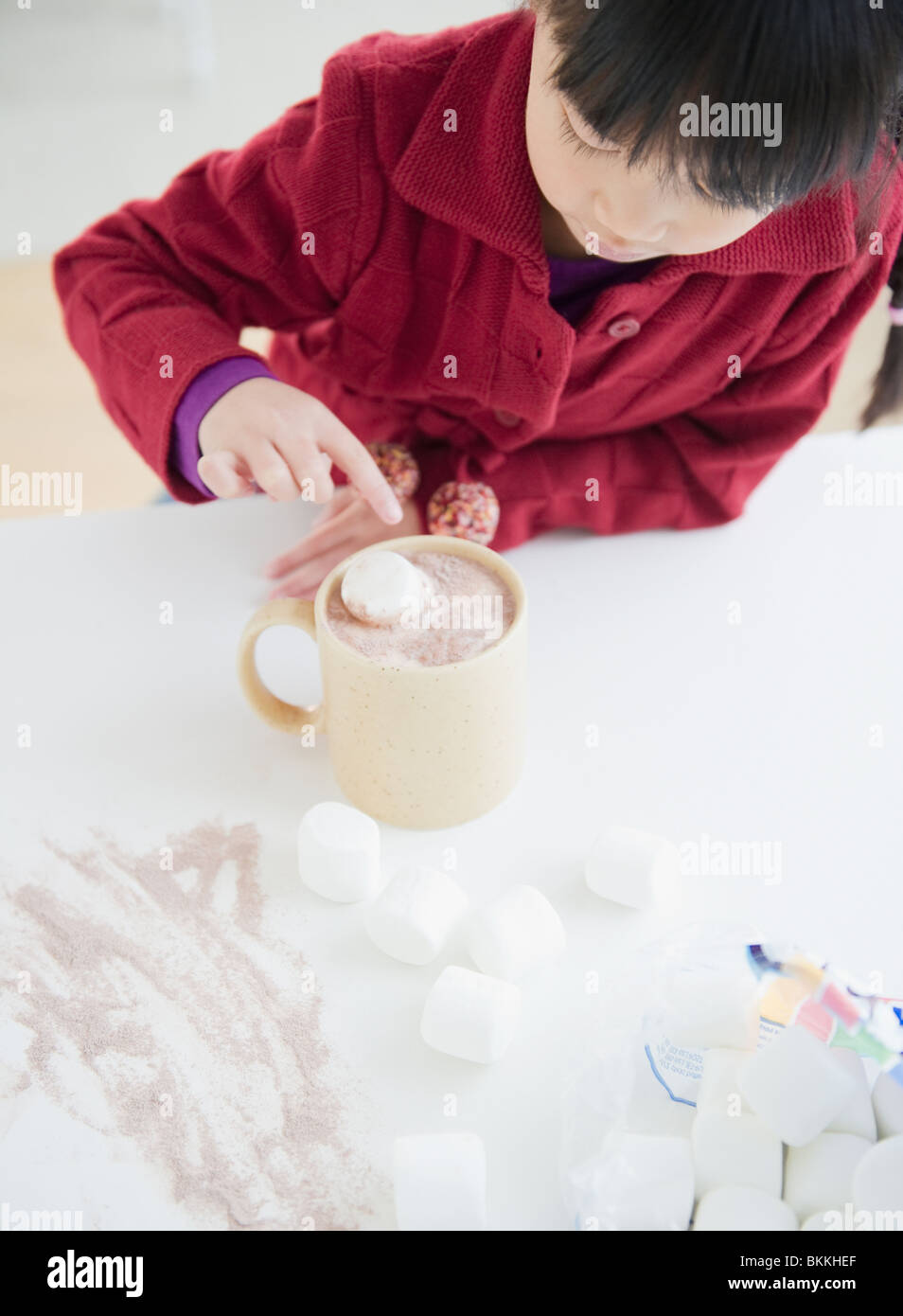 Chinese girl making hot chocolate Stock Photo - Alamy
