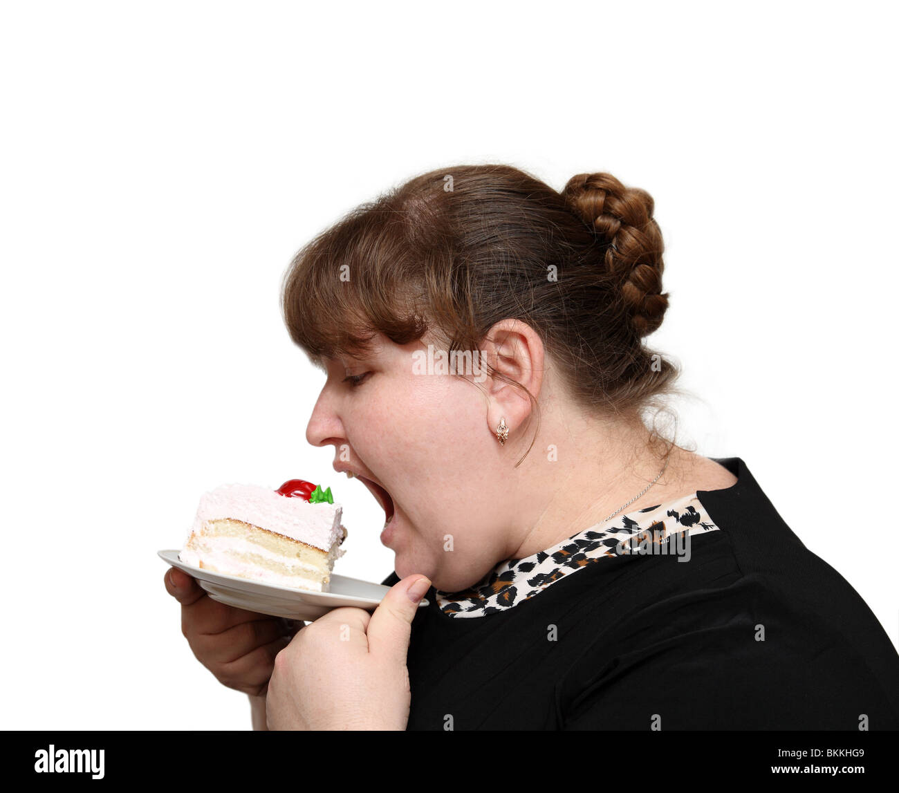overweight woman greedy biting sweet cake on white background Stock ...